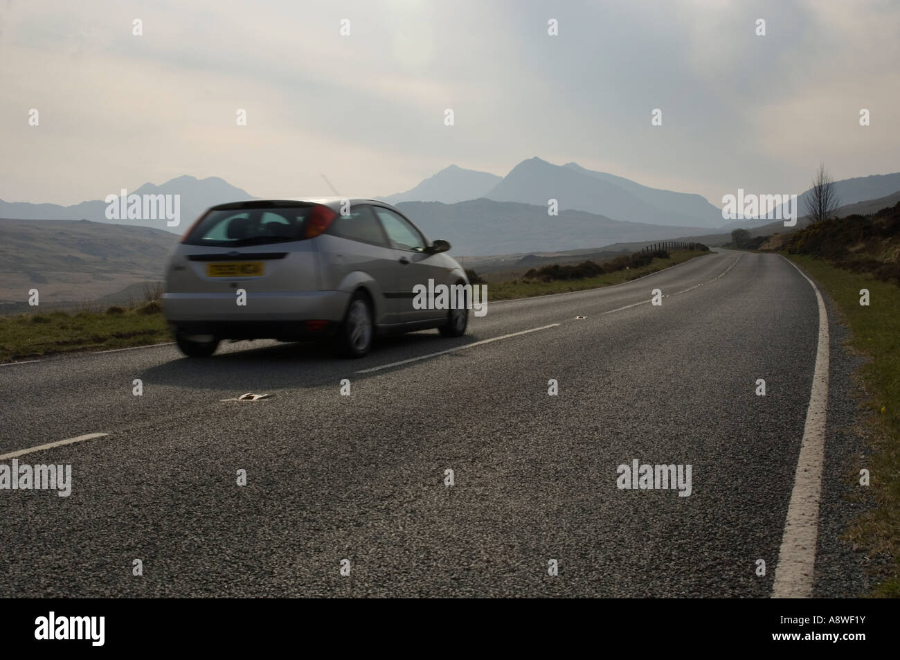 Car driving along the A4086 towards Snowdon snowdonia national park ...
