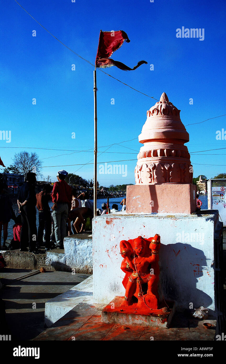 monkey God Hanuman hindu temple with flag fluttering Stock Photo - Alamy