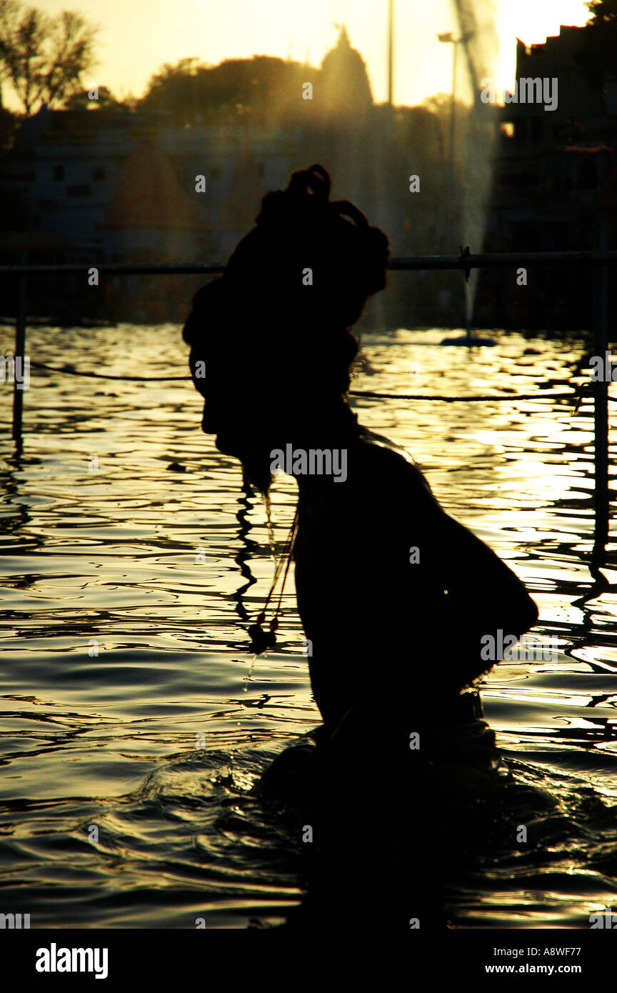 SUB90578 Indian holy man priest sadhu bathing in Shipra river during ...