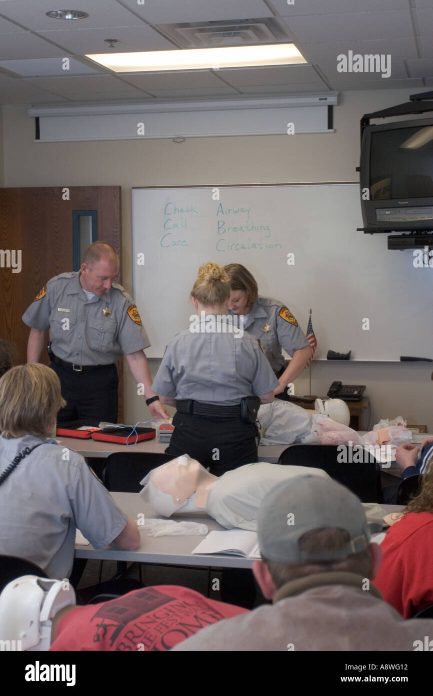 Corrections officers learning CPR and how to use an automatic ...