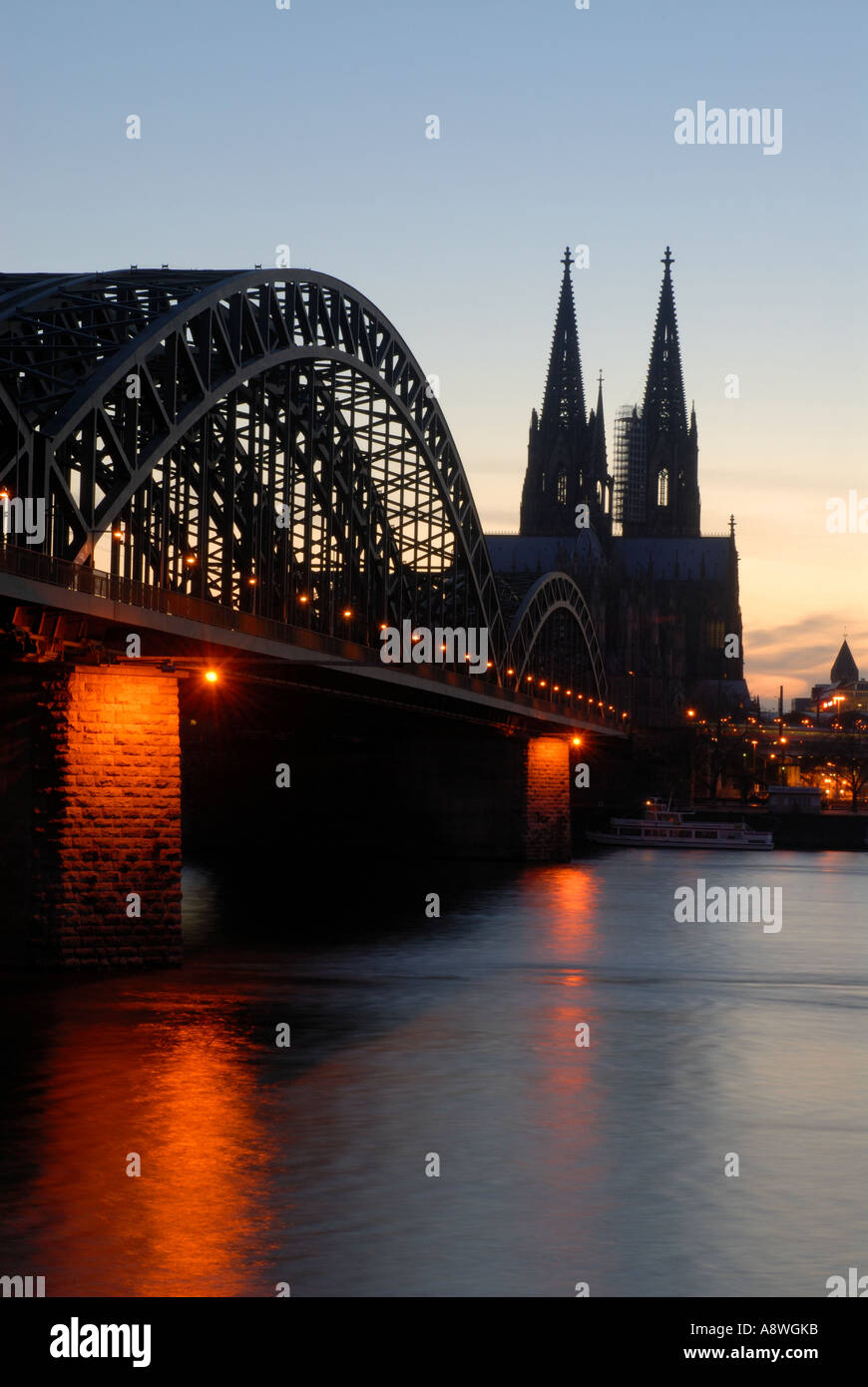 Cologne Cathedral with Hohenzollern Bridge at sunset Stock Photo - Alamy