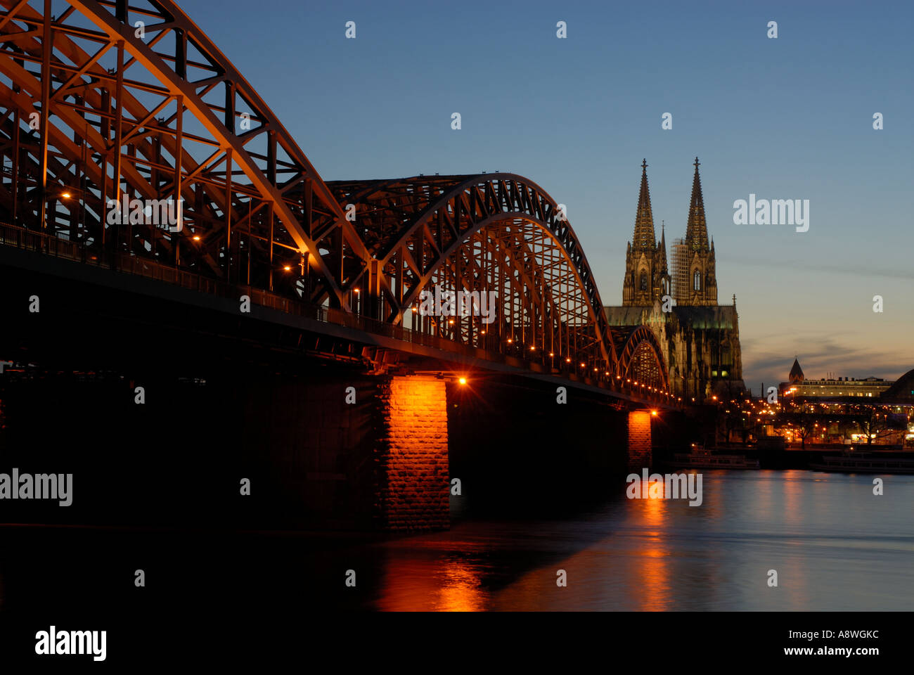 Cologne Cathedral with Hohenzollern Bridge at sunset Stock Photo - Alamy