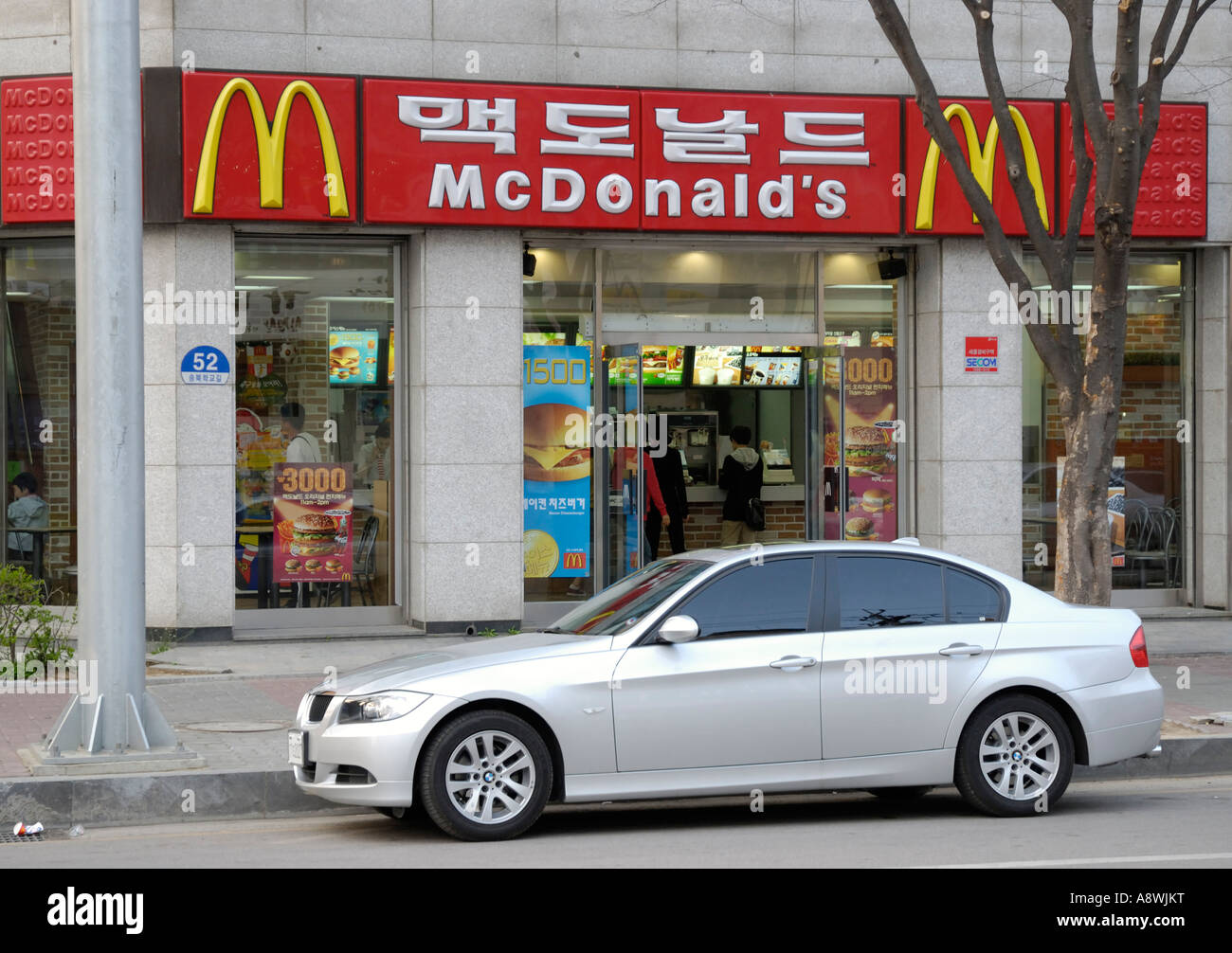 A BMW sports car in front of an American fast food chain, Pyeongtaek KR ...