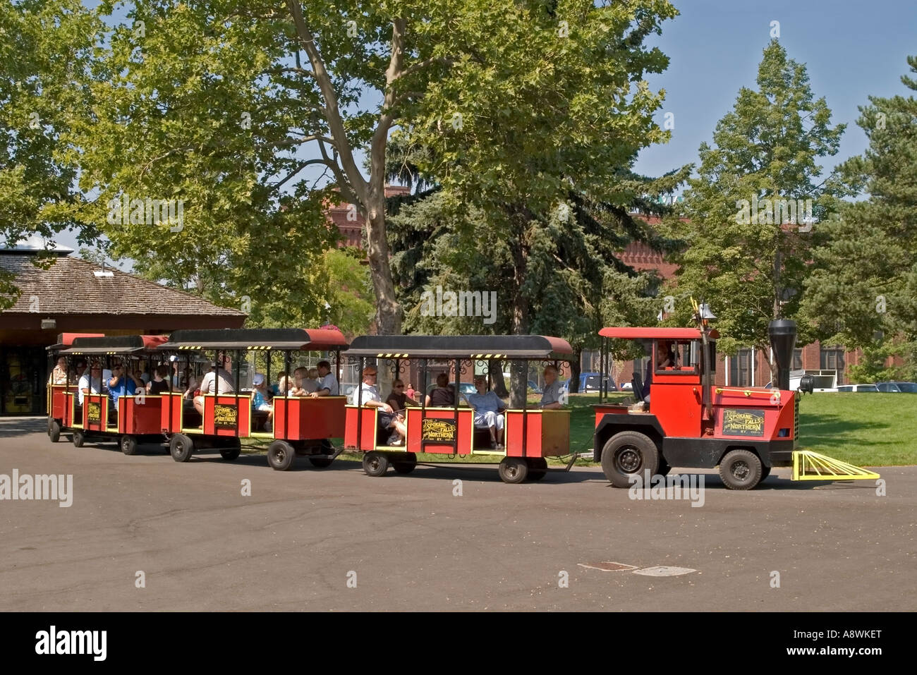 Tourist train leaves from kiosk small train hi-res stock photography ...