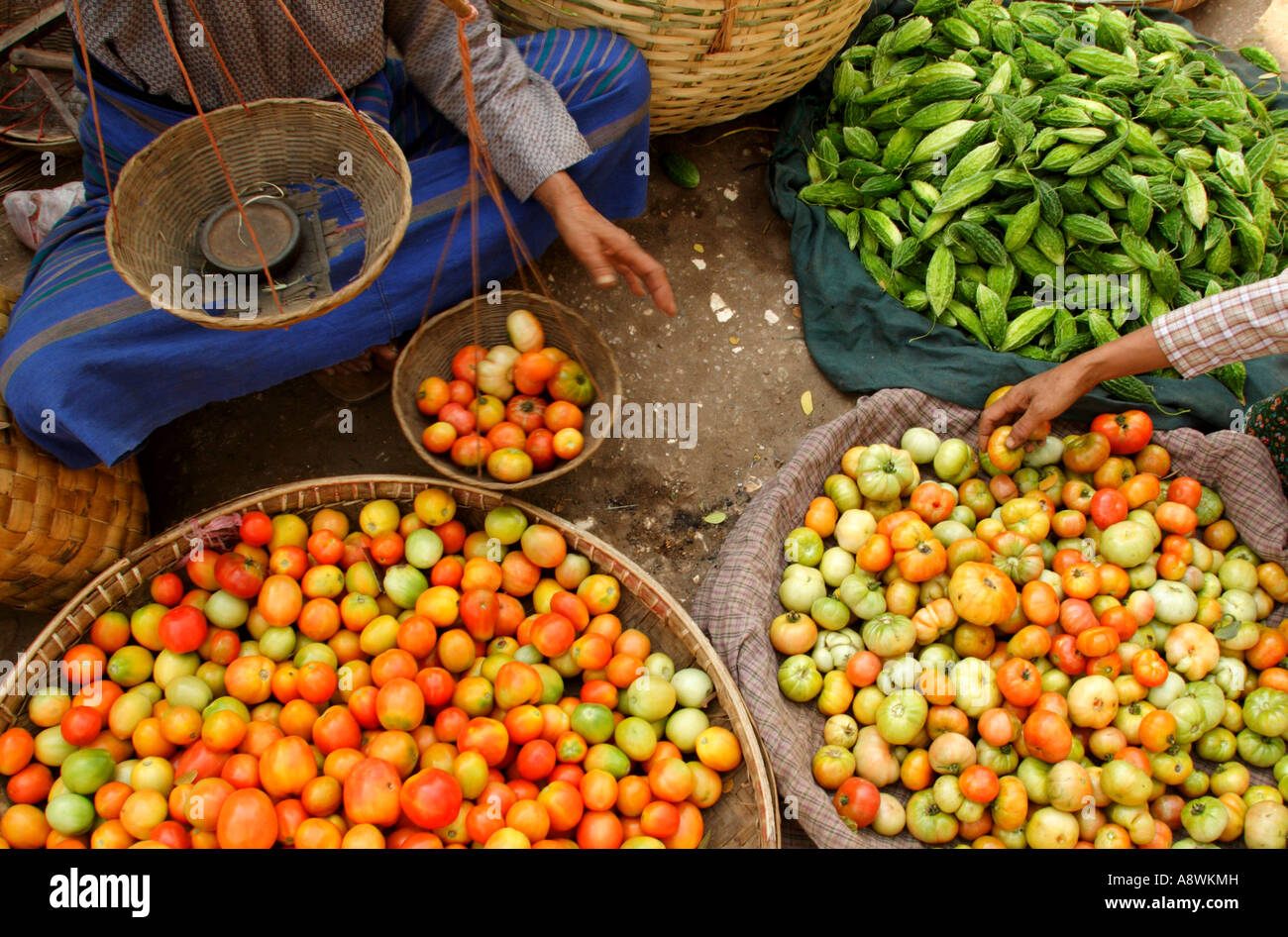 Asia, Myanmar, Nyaungshwe vegetable hawker weighing tomatoes Stock ...