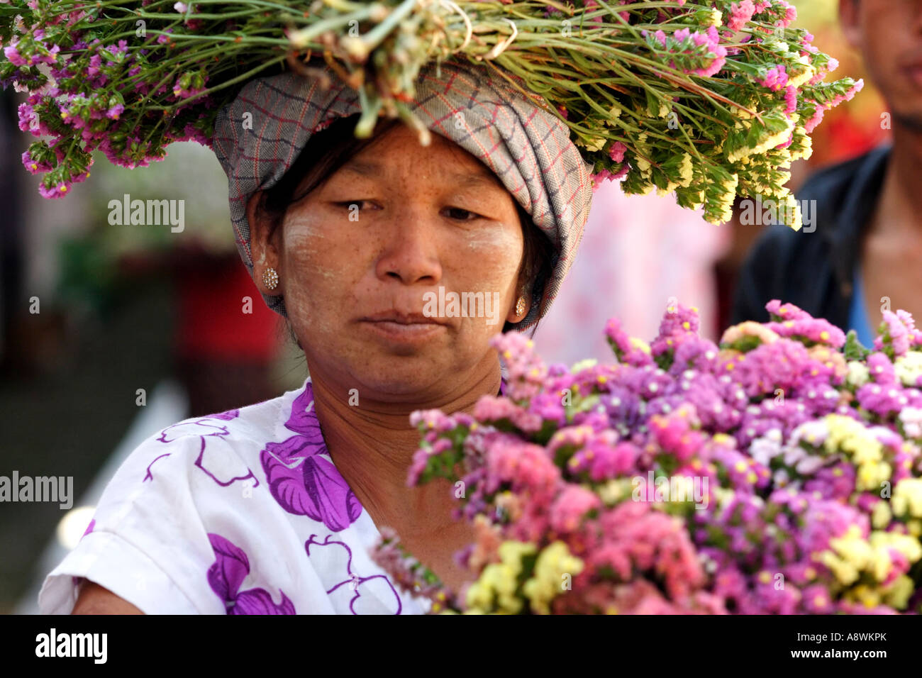 Asia, Myanmar, Burmese, woman selling flowers at train stop Stock Photo ...