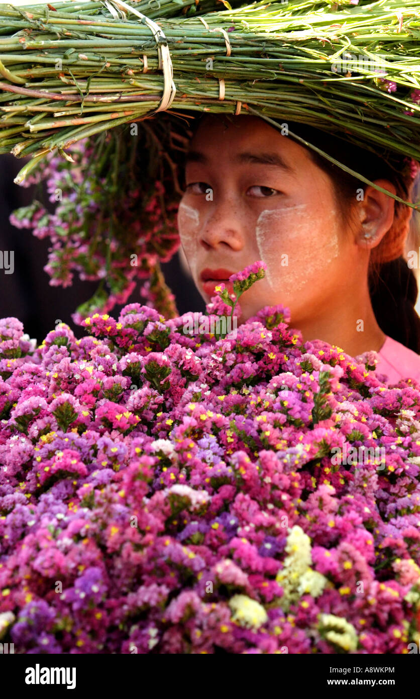 Asia, Myanmar, Burmese woman selling flowers at train stop Stock Photo ...