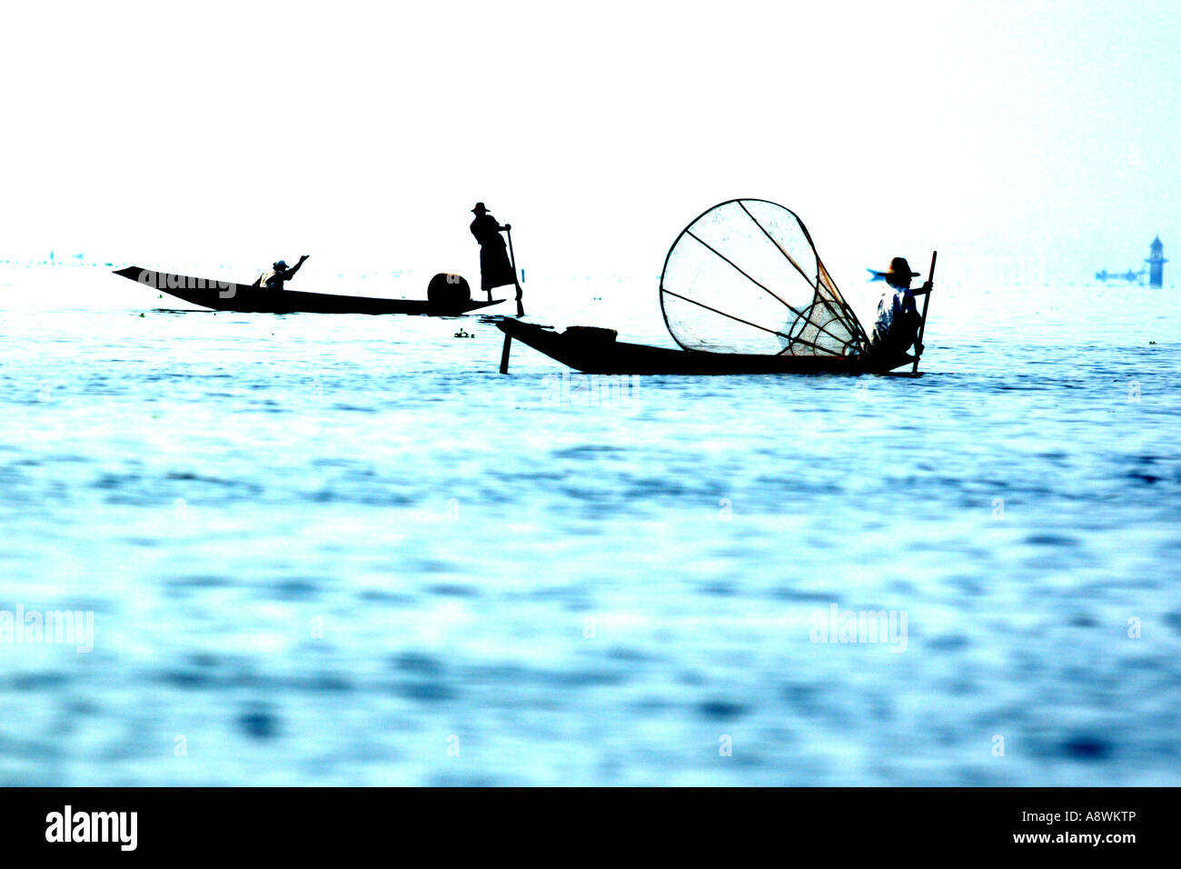 Asia, Myanmar, Inle Lake, leg rowing Intha fishermen with conical ...