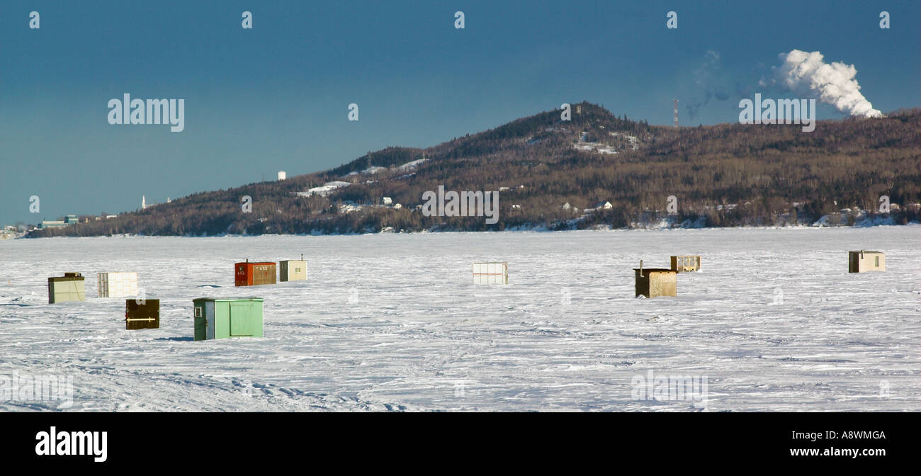 Fisherman shelters on the frozen sea at Escuminac Quebec on the Gaspe ...