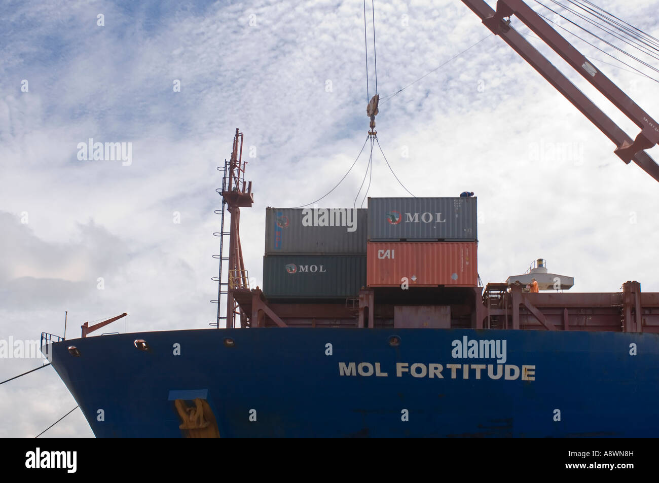A Container ship docked in the port of Manaus unloading or loading ...