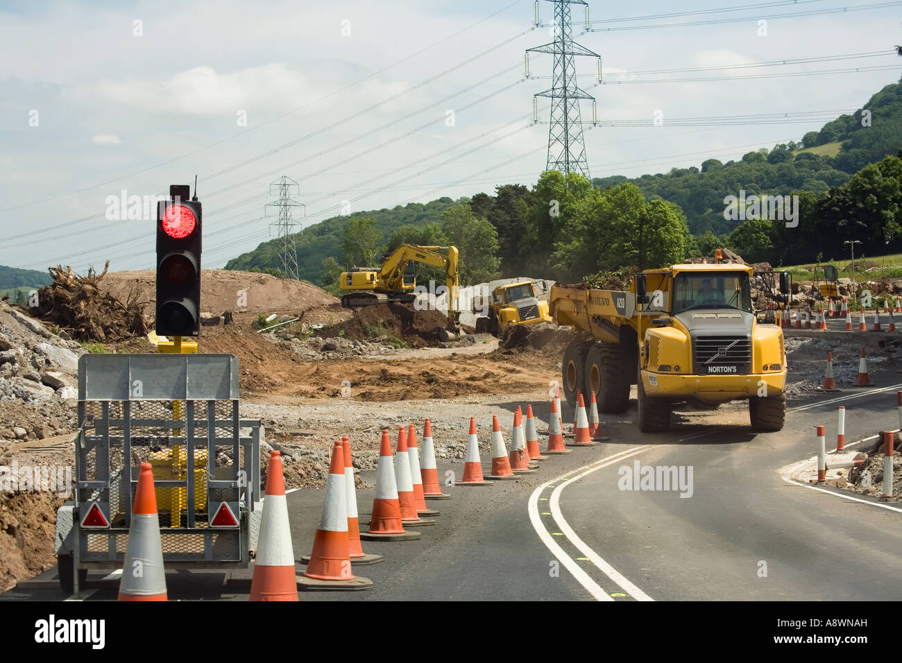 Lorry entering road between traffic lights during road widening scheme ...