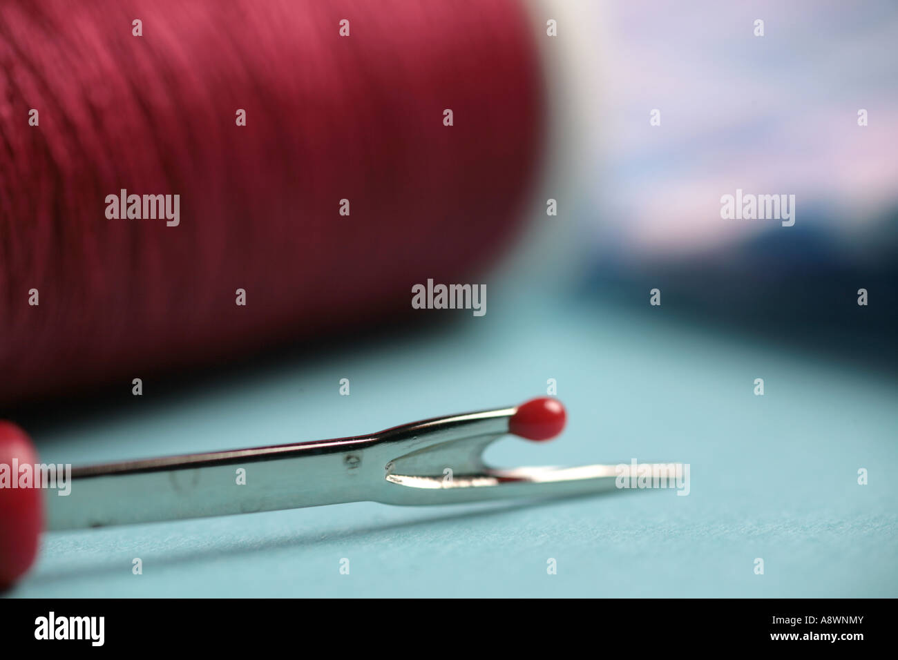 cotton reel and stitch picker Stock Photo - Alamy