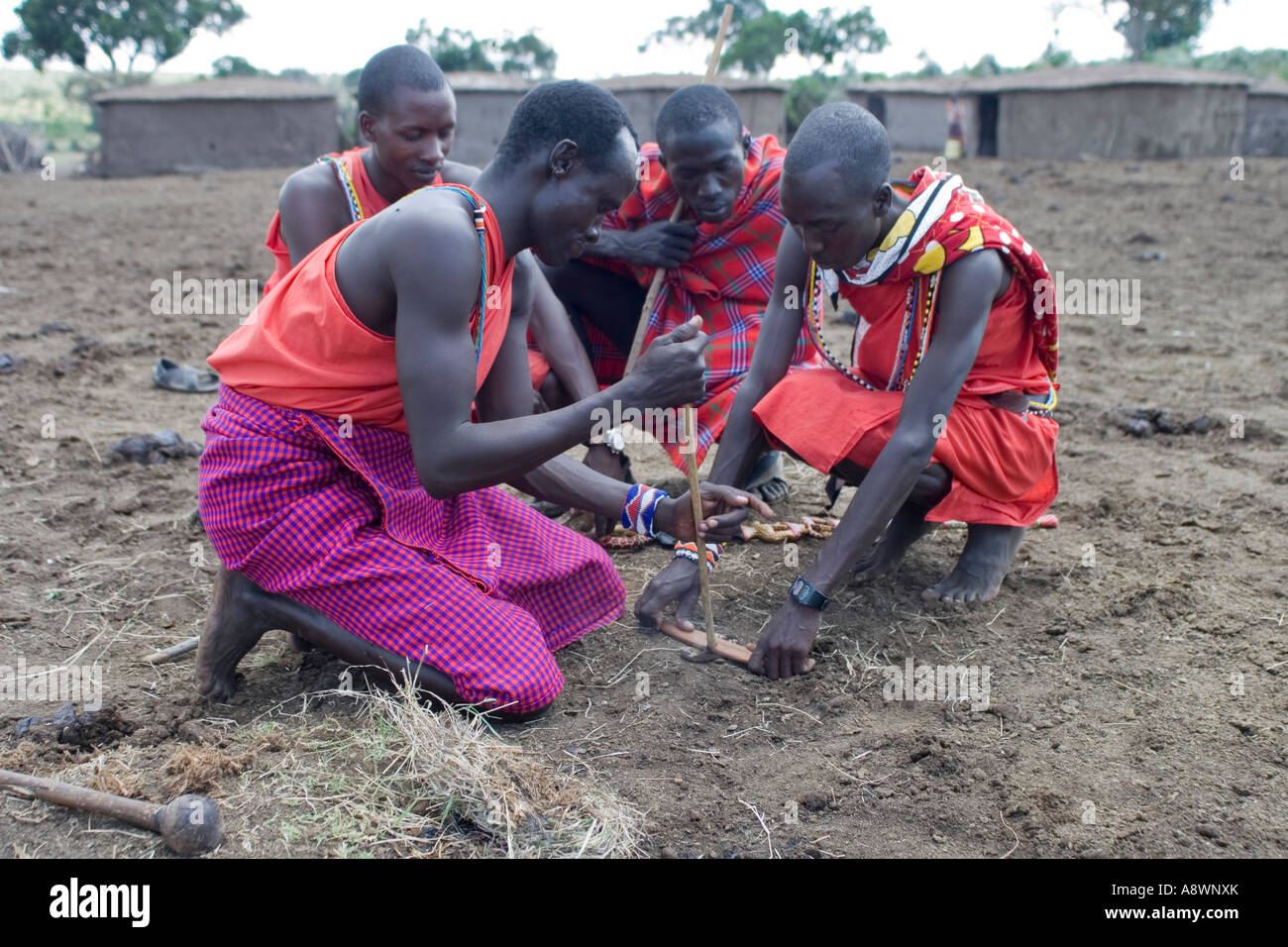 masai tribesman demonstrating traditional fire making Stock Photo - Alamy