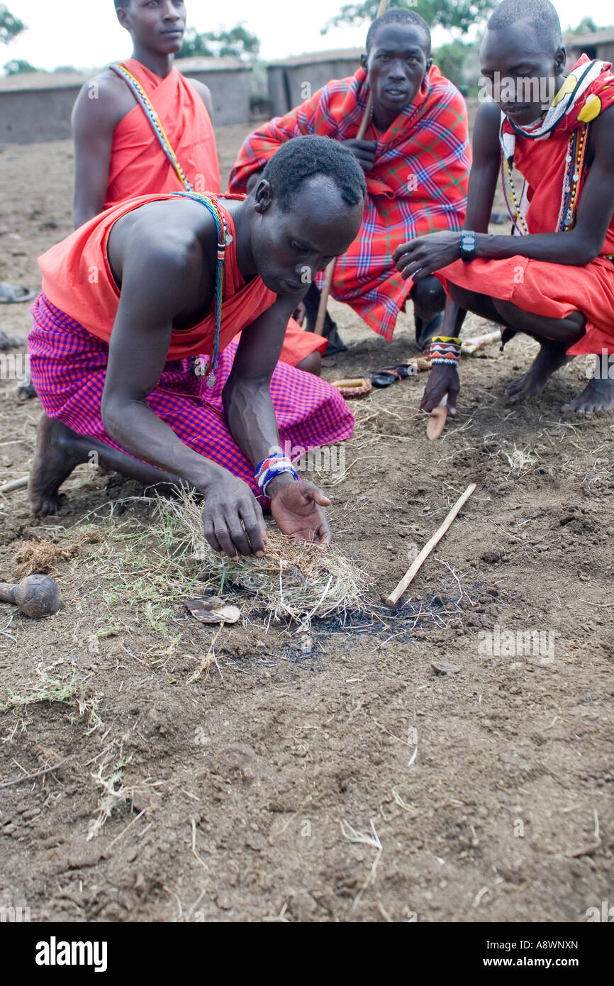 masai tribesman demonstrating traditional fire making Stock Photo - Alamy