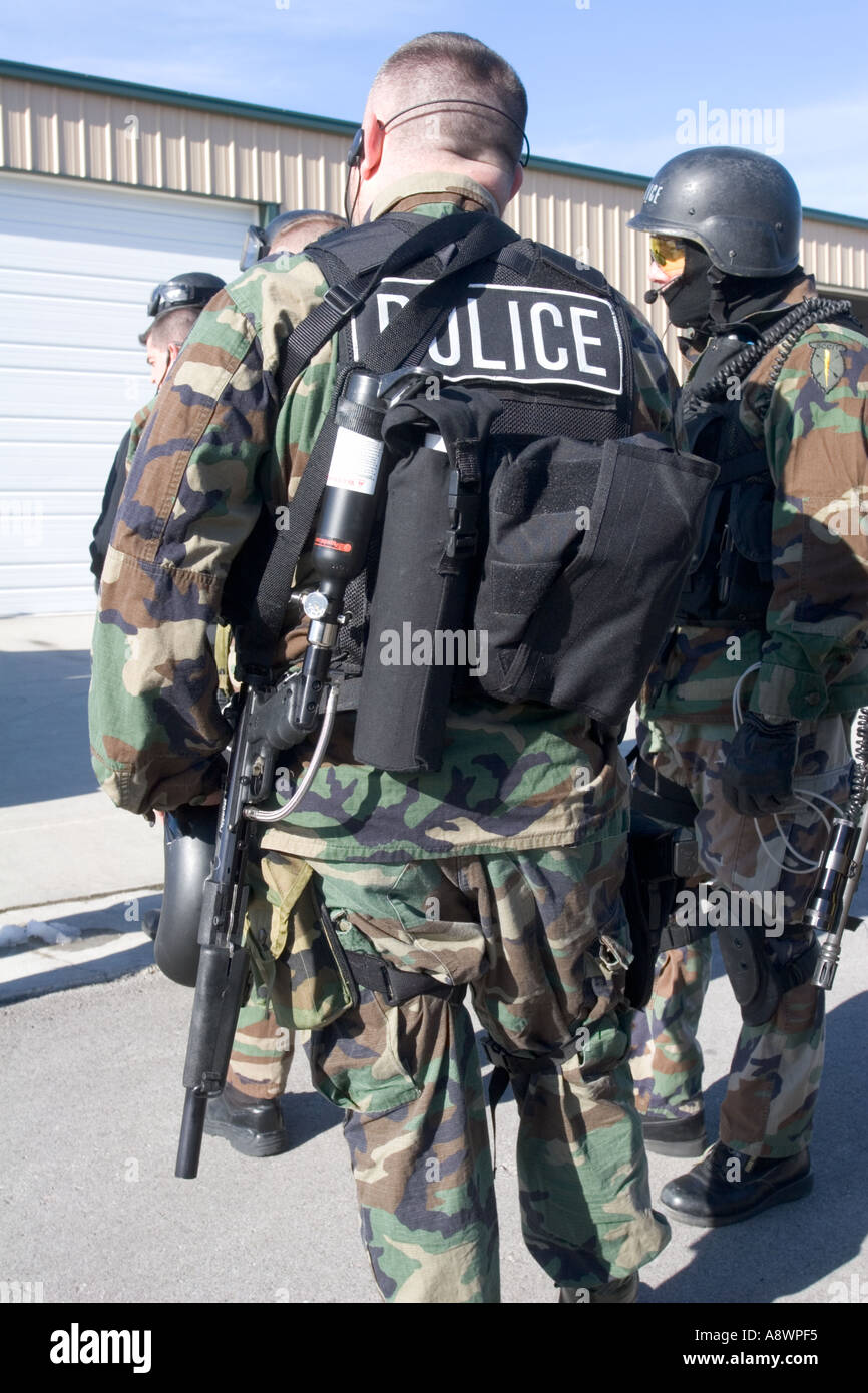 SWAT team gearing up prior to serving search warrant Officer is ...