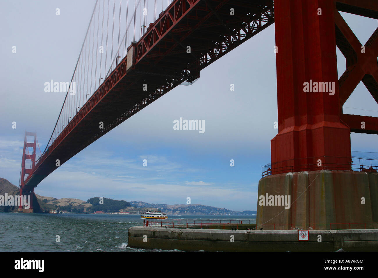 A sightseeing cruise boat goes under the Golden Gate bridge Stock Photo ...