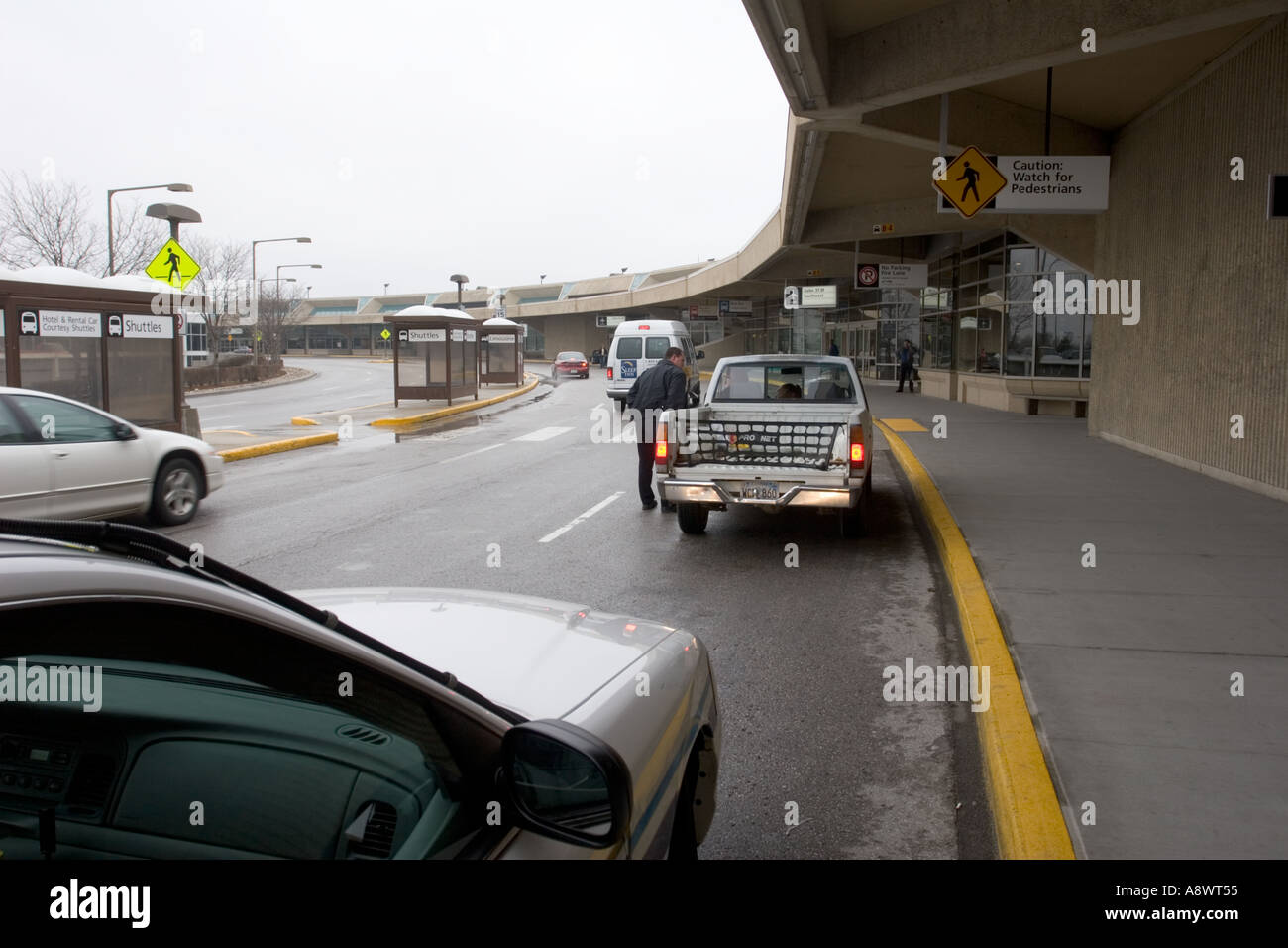 Police officer conducting a traffic stop outside the terminal building ...