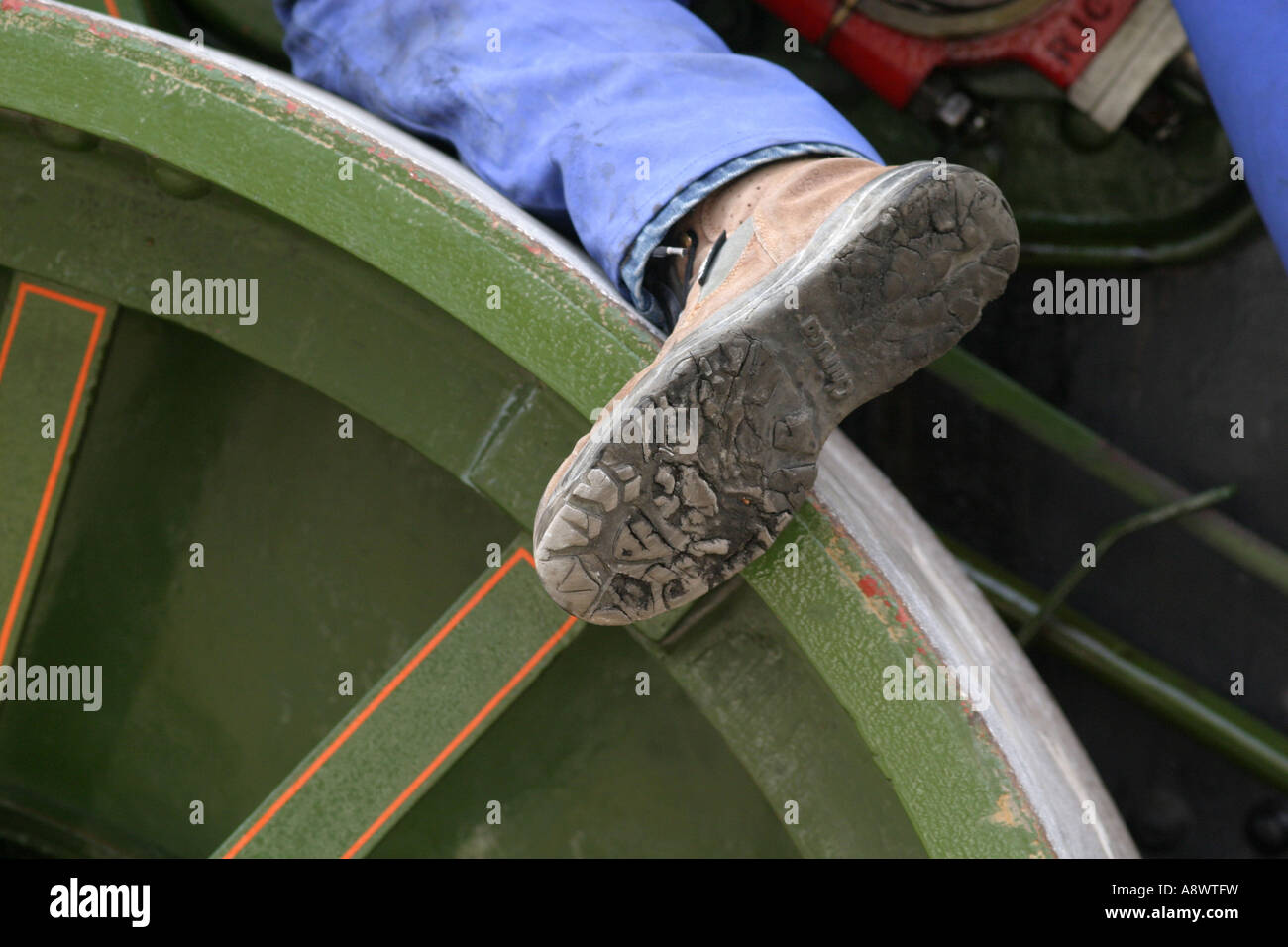 Steam enthusiasts foot over wheel Stock Photo - Alamy