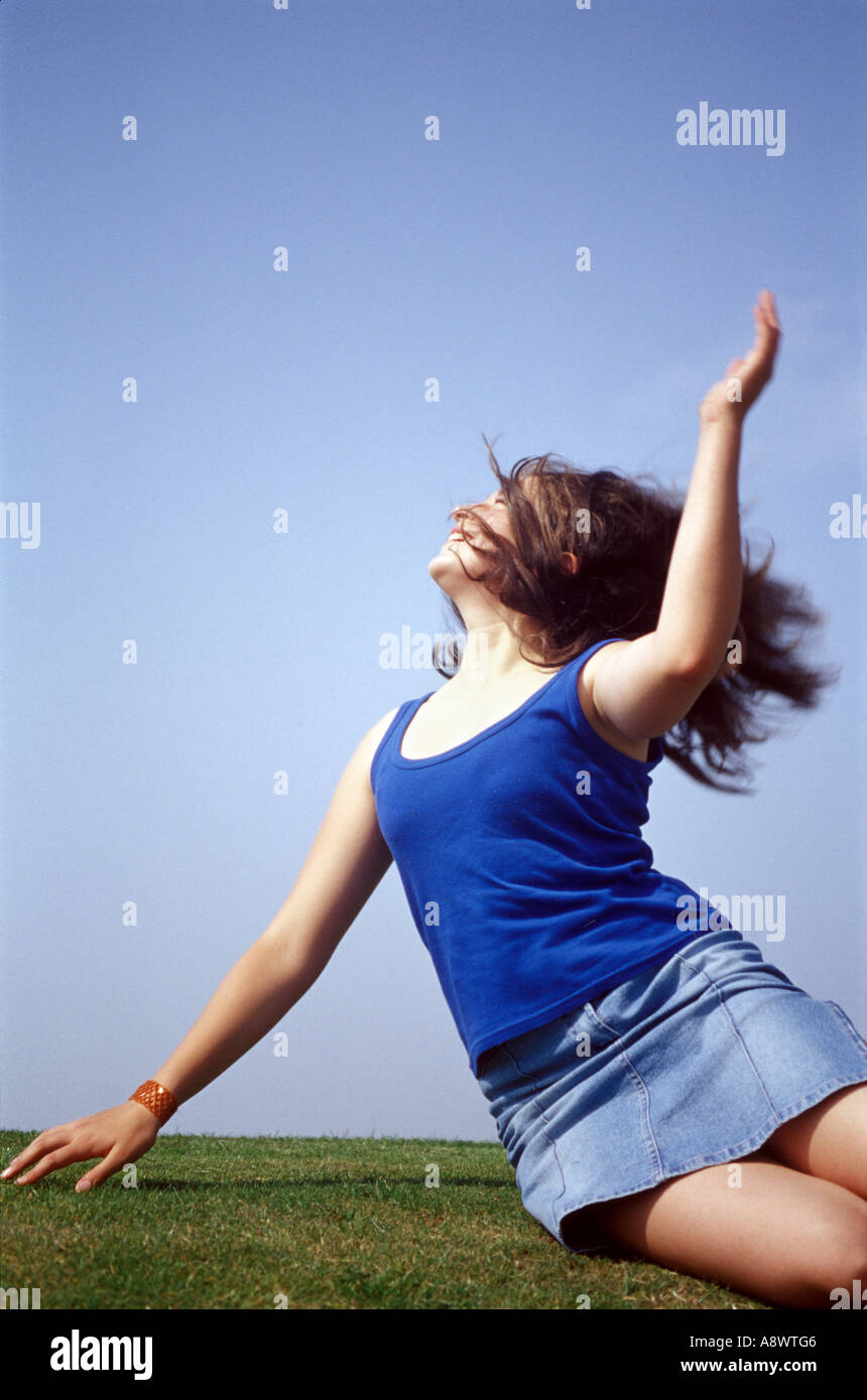 Teenage girl throwing her hair back Stock Photo - Alamy