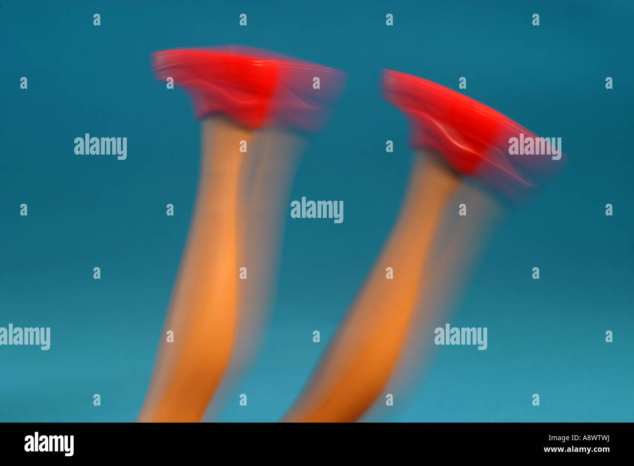 dolls legs wearing red shoes Stock Photo - Alamy