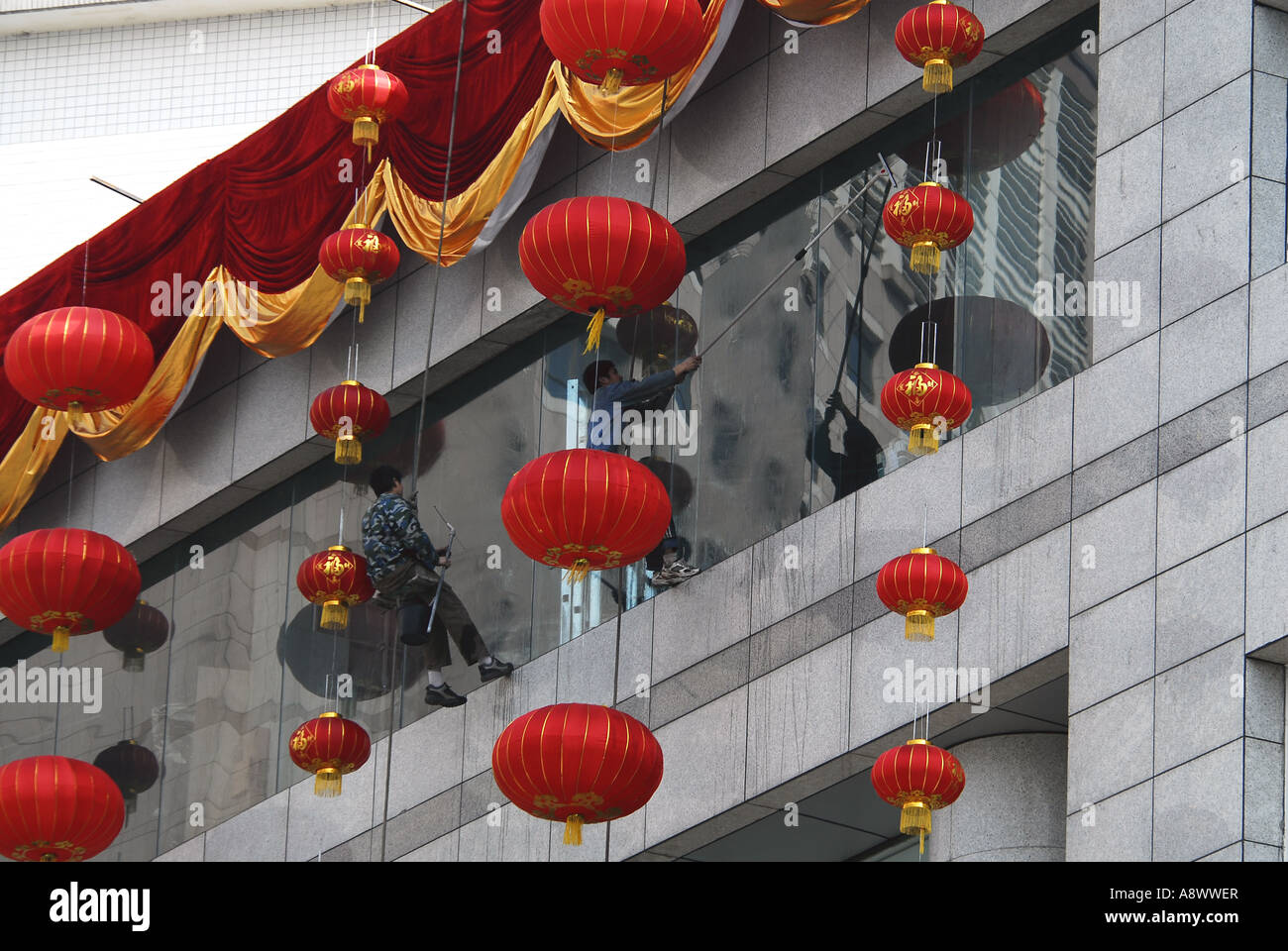 Window cleaners abseiling down ICBC bank,Chengdu,China just before ...