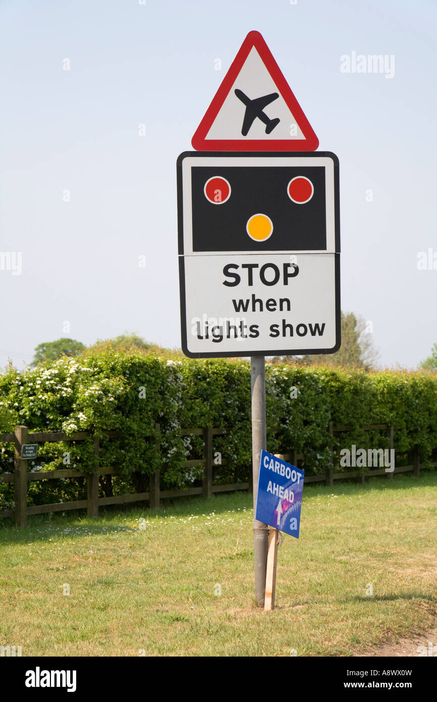 Stop when lights show. Information and warning sign on side of the road ...