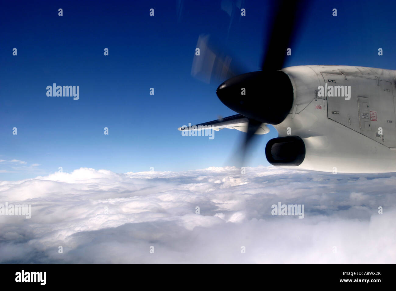 View out of Aircraft Window above the clouds prop propeller plane Stock ...
