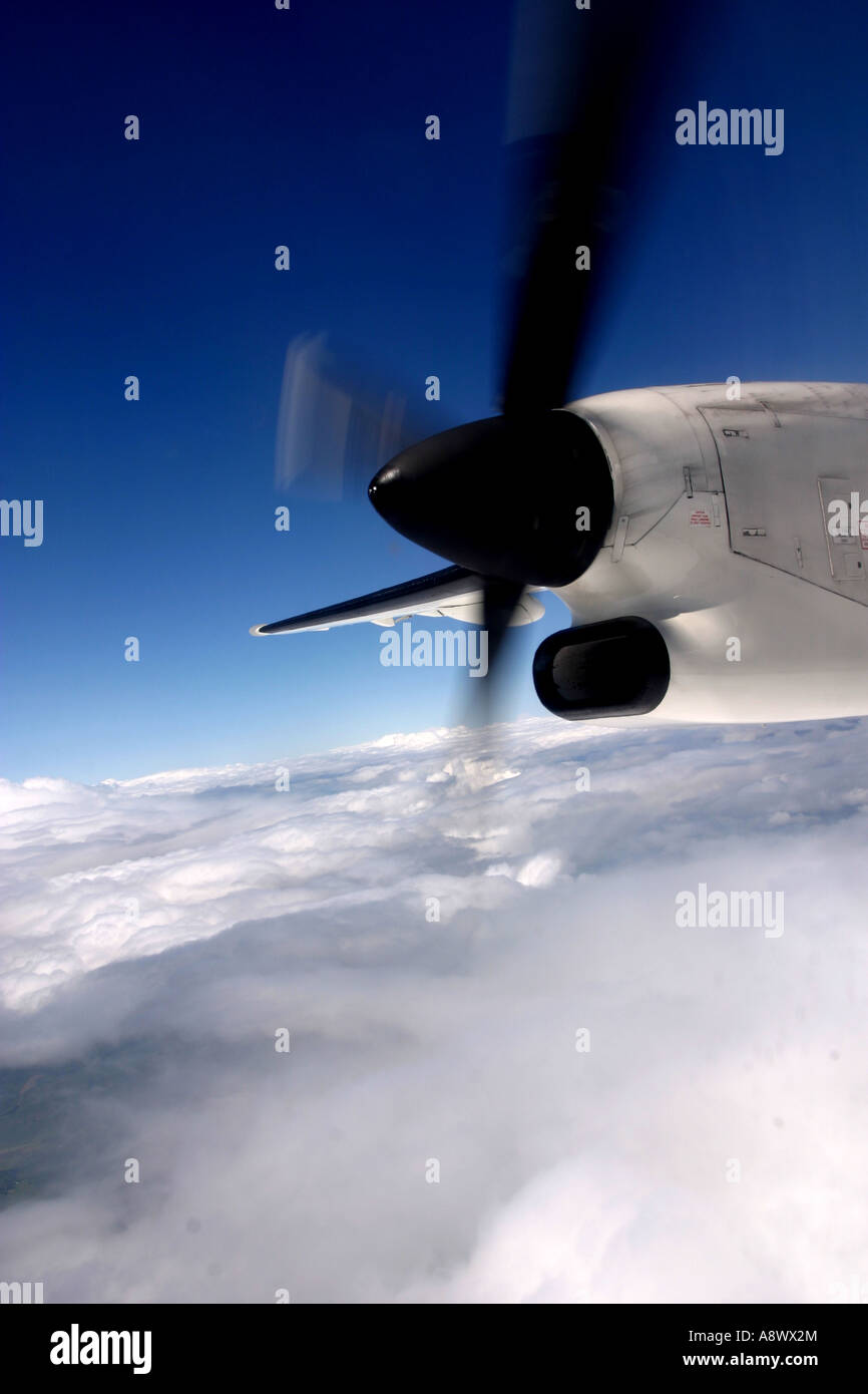 View out of Aircraft Window above the clouds prop propeller plane Stock ...