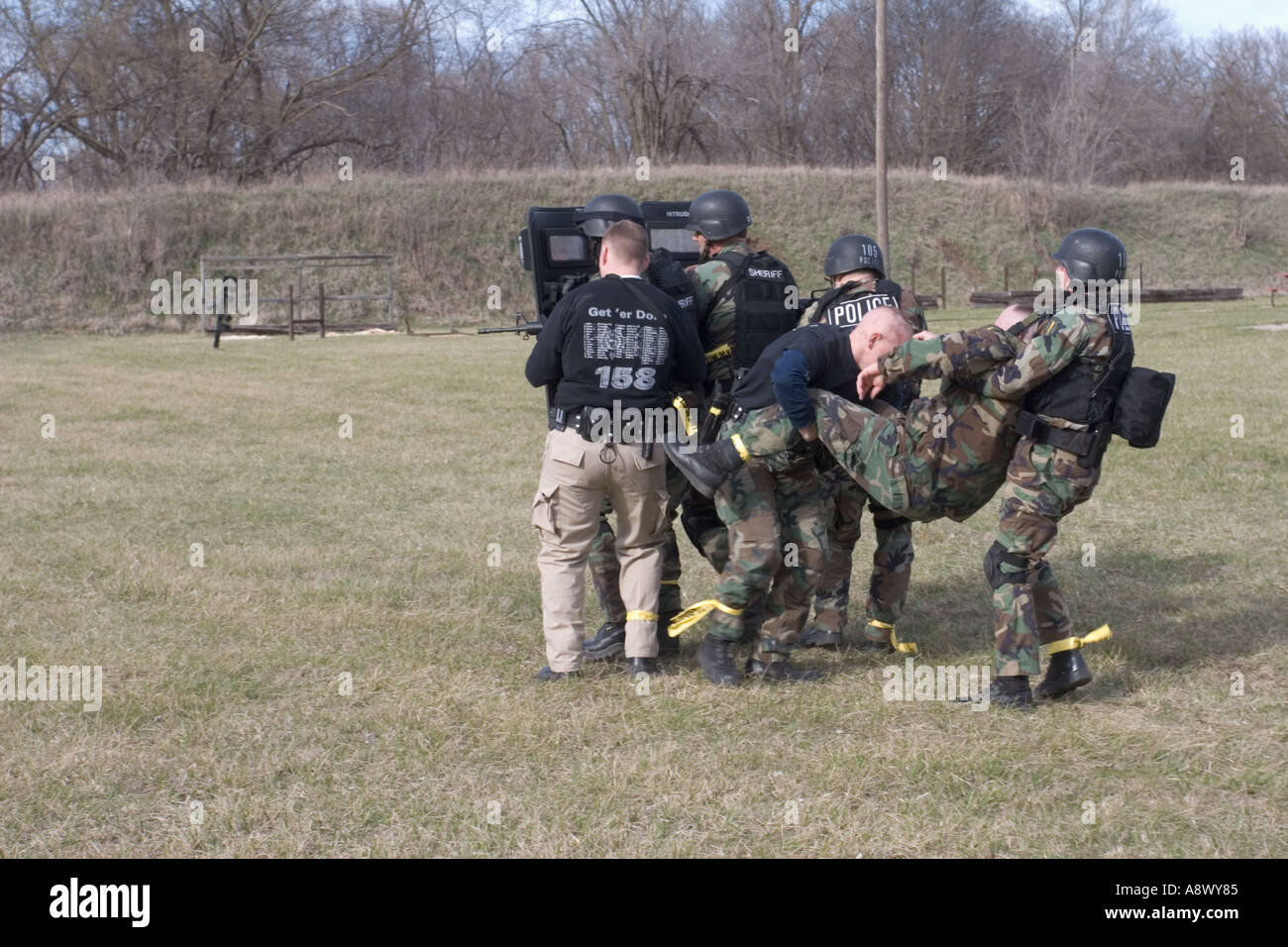 SWAT team training Retrieving injured officer from line of fire hot ...