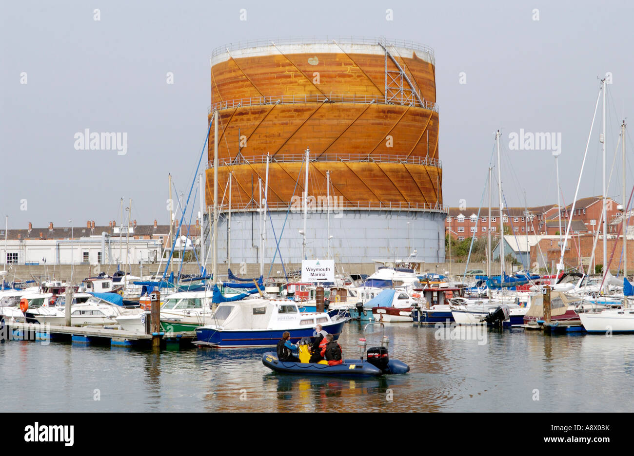 Gasometer that dominates the marina at Weymouth Dorset Southern England ...