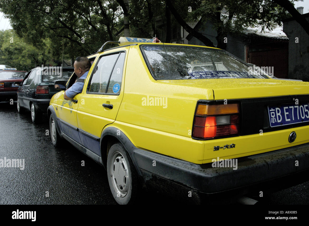 Man driving a taxi cab while stuck in a traffic jam, Beijing, China ...