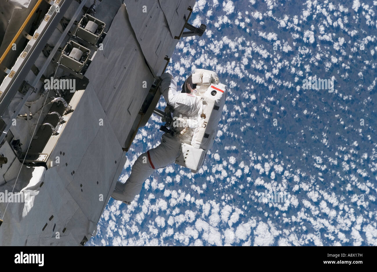 Performing an installation on the International Space Station Stock ...