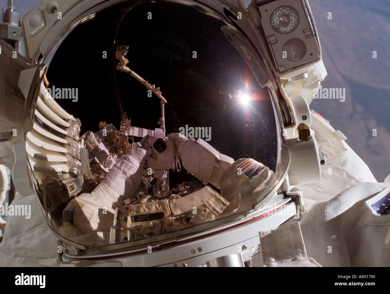 Astronaut Joseph R Tanner photographs himself during a space walk Stock ...