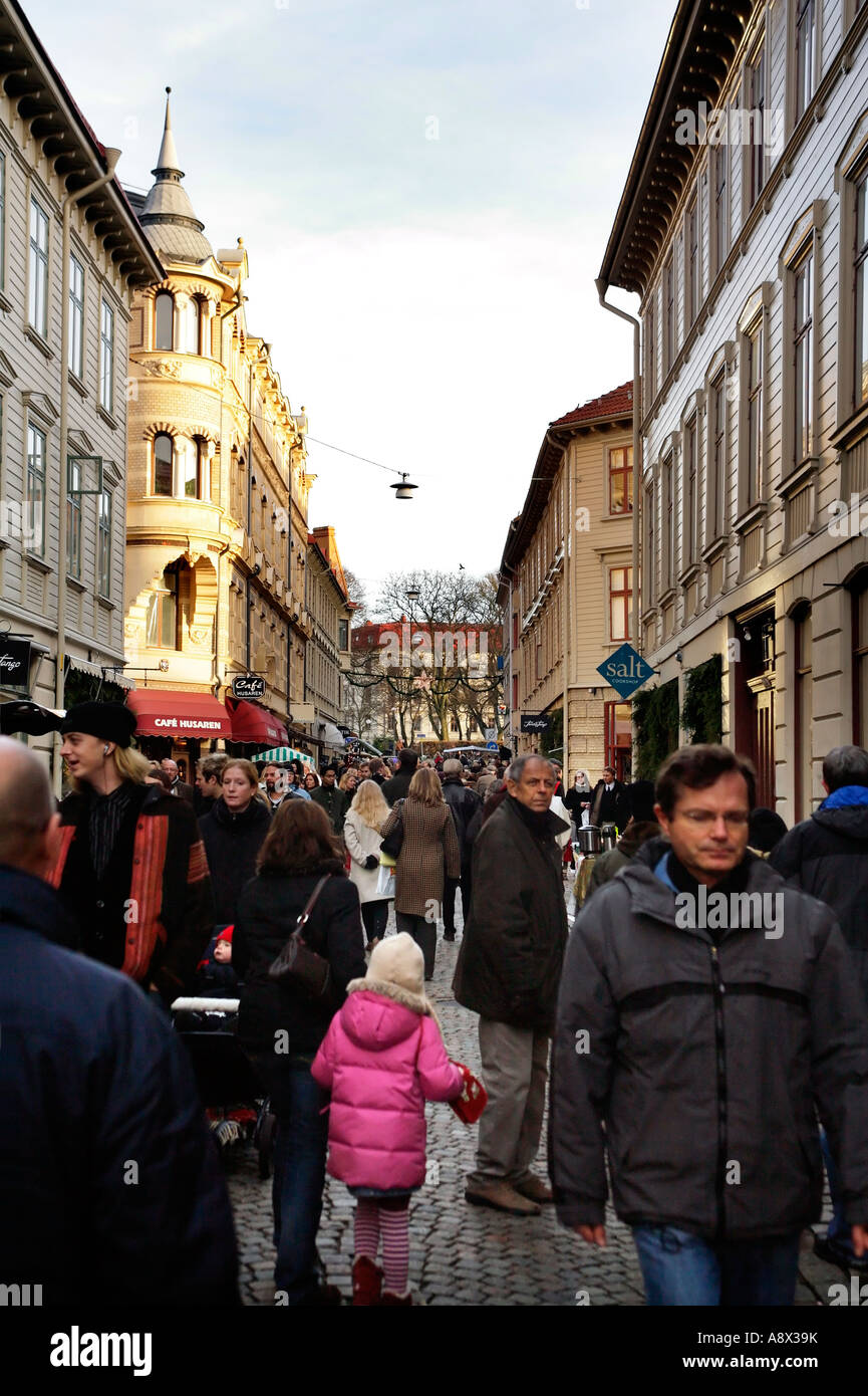 People jostling for elbow space in the narrow streets of picturesque ...