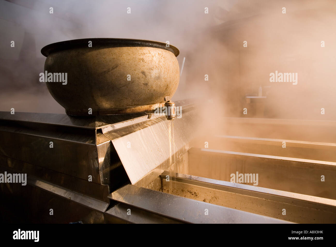 Boiling tree sap in evaporator making maple syrup upstate New York ...