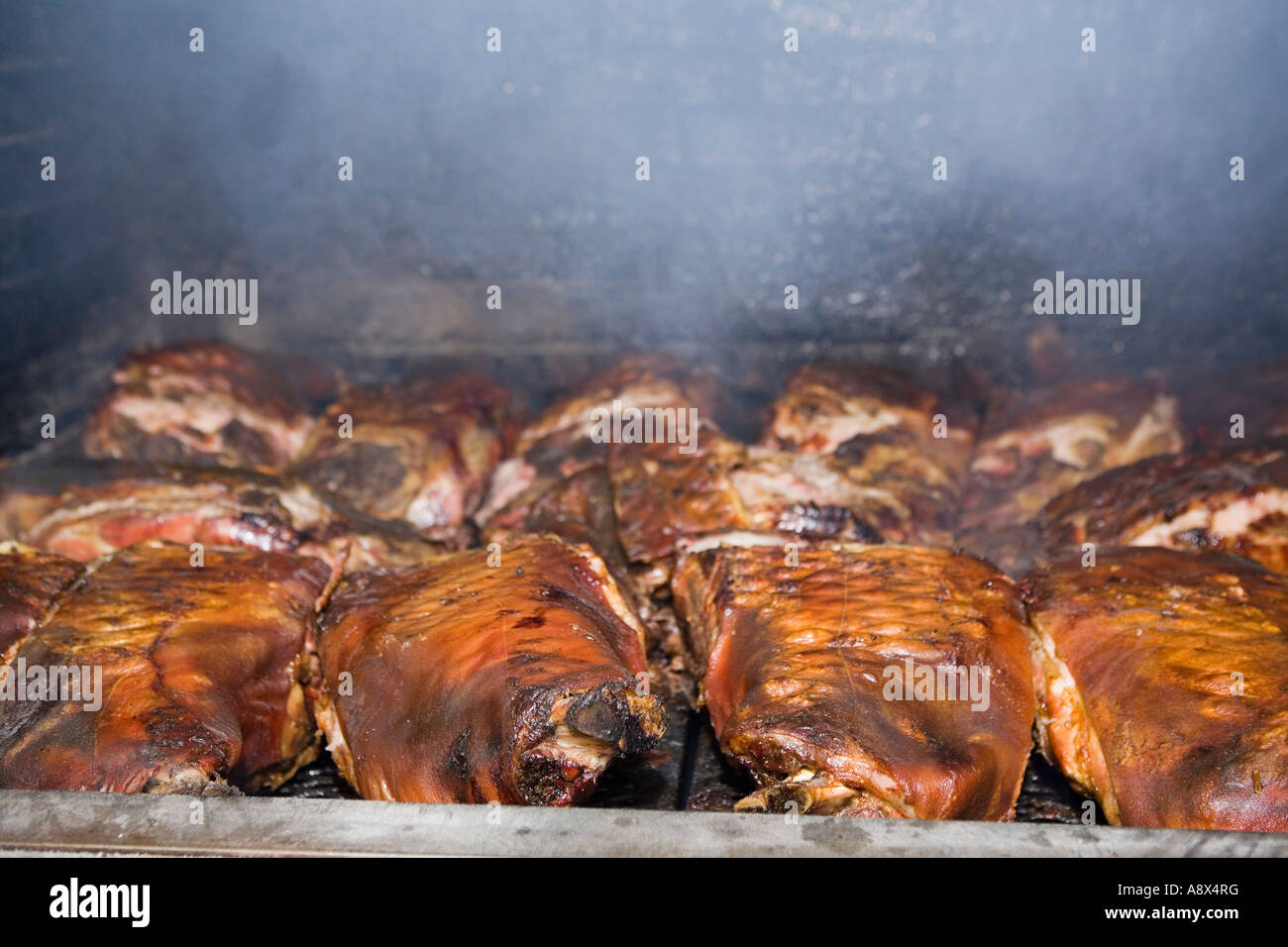 Pork shoulders pit cooking, North Carolina Stock Photo - Alamy