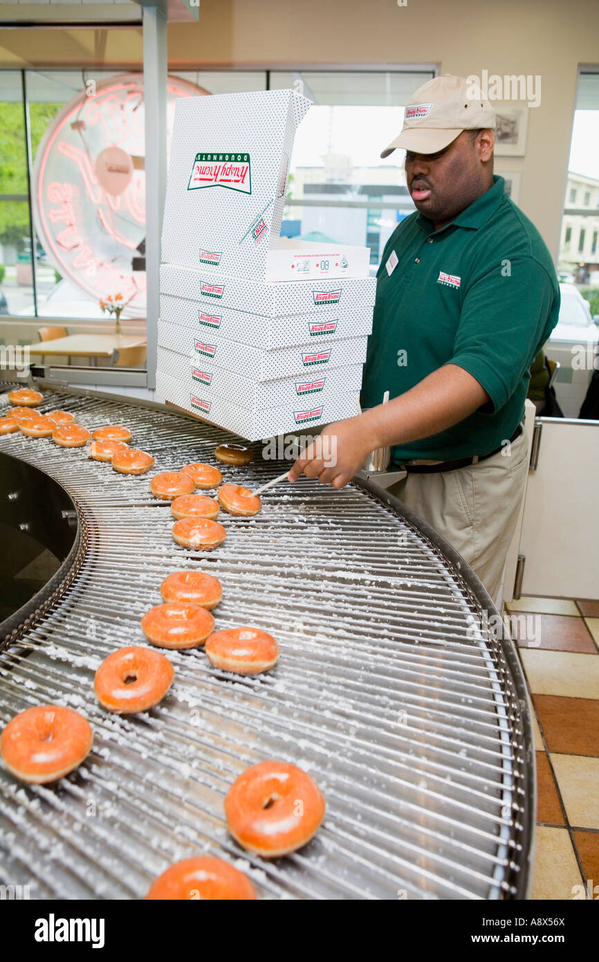 Making donuts at the original Krispy Kreme Winston Salem North Carolina ...
