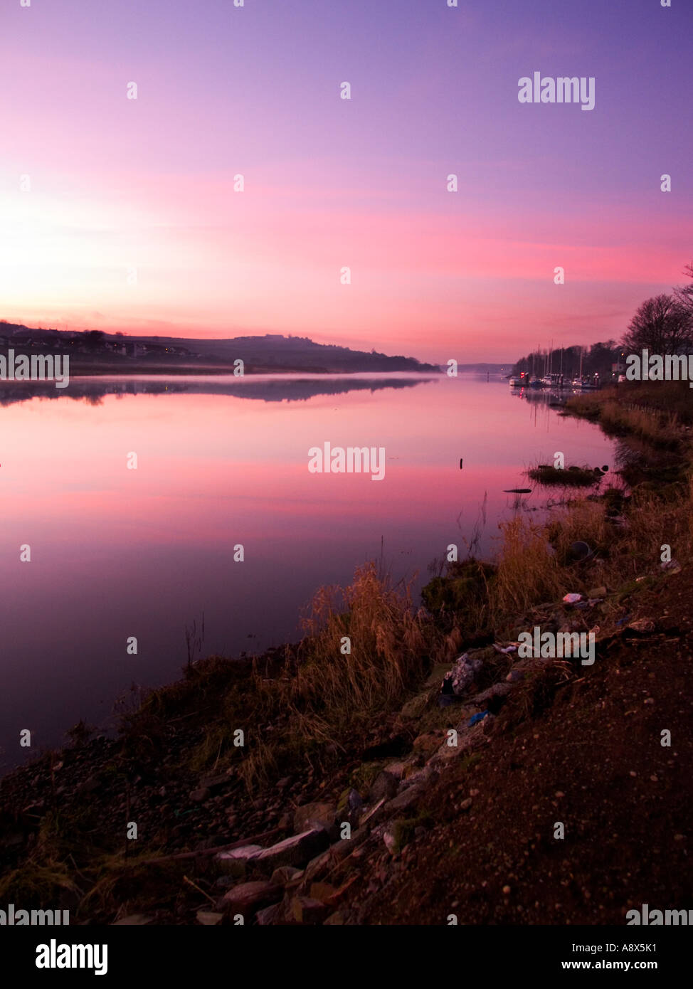 The stunning pink and golden hues of the sun setting on the Lower Bann ...
