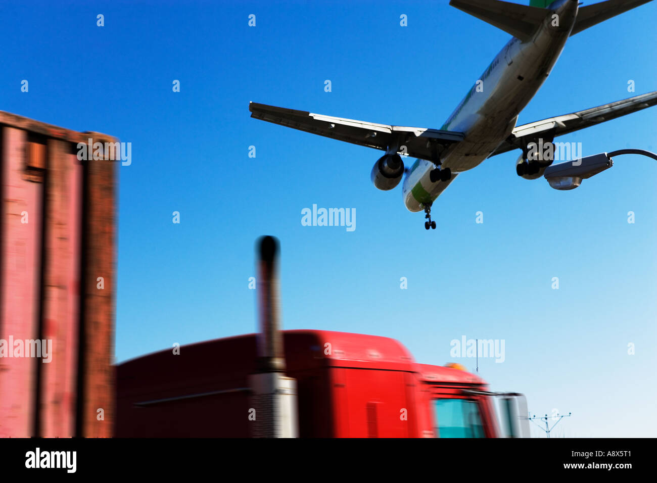 AIRPLANE OVER TRUCK Stock Photo - Alamy