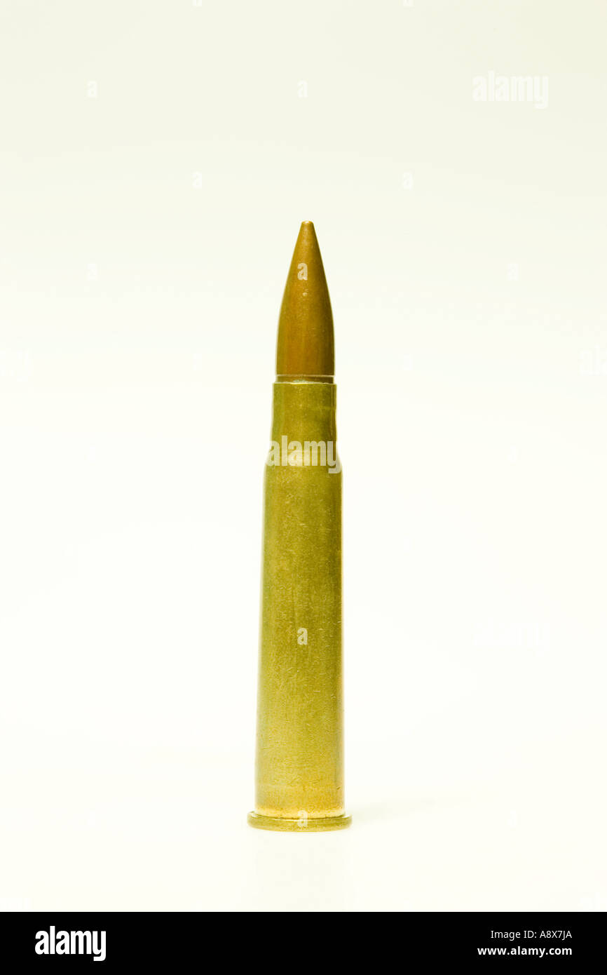 Military rifle bullet against white background Stock Photo - Alamy