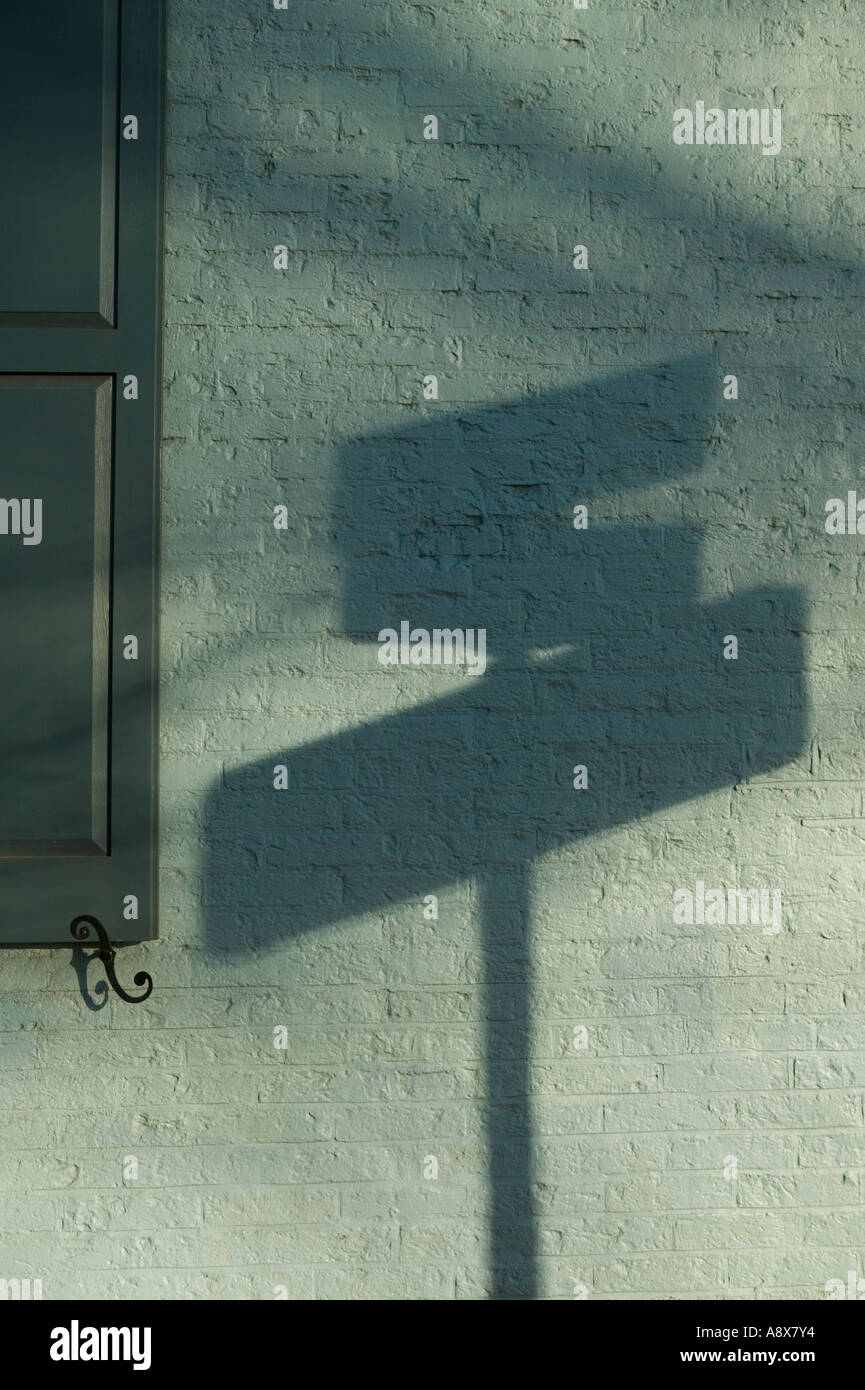 Street sign shadow on painted brick plus shutter detail Annapolis ...