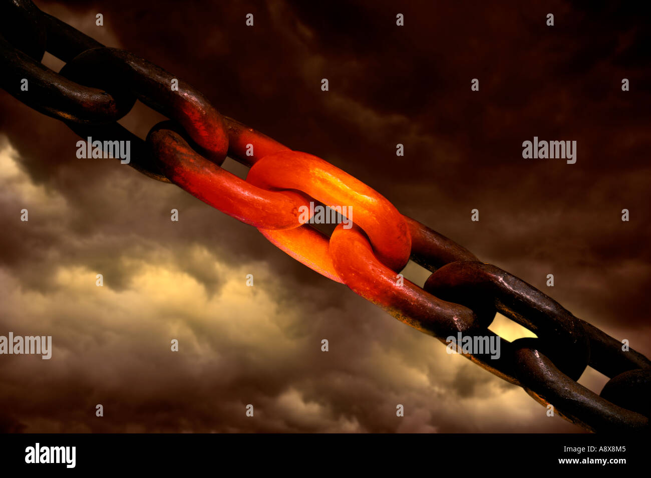 GLOWING HOT STEEL CHAIN WITH RED AND GOLD DARK THUNDERY STORM CLOUDS IN ...