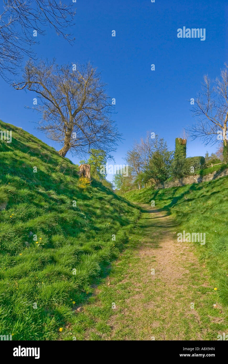 footpath through moat grounds of clun castle shropshire the midlands ...