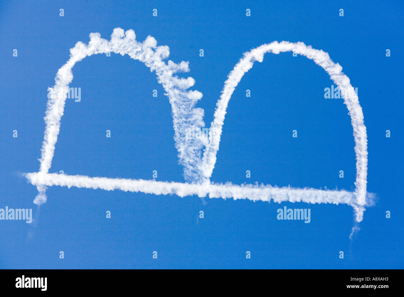 Airplane skywriting a B Stock Photo - Alamy