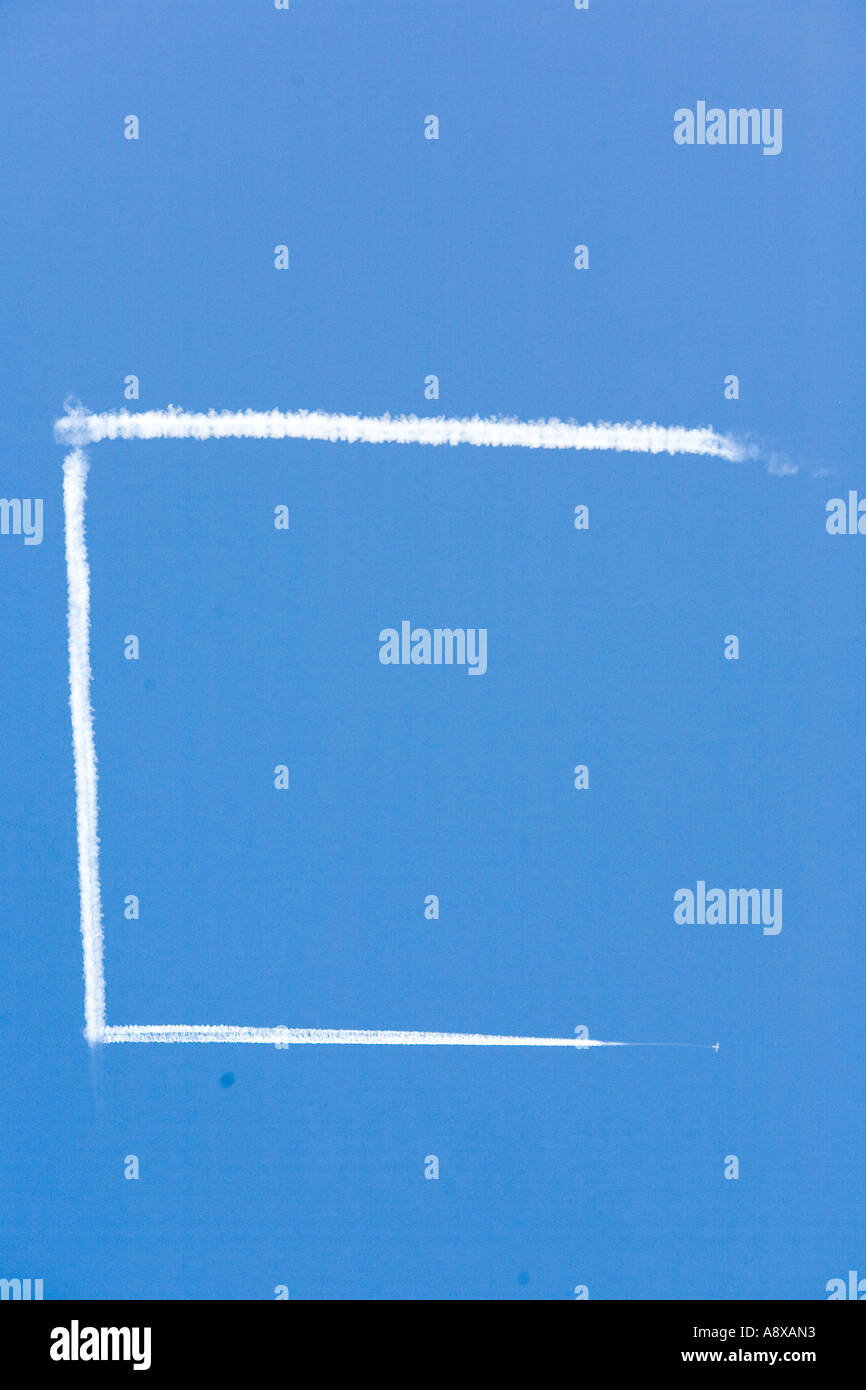 Airplane skywriting a square Stock Photo - Alamy