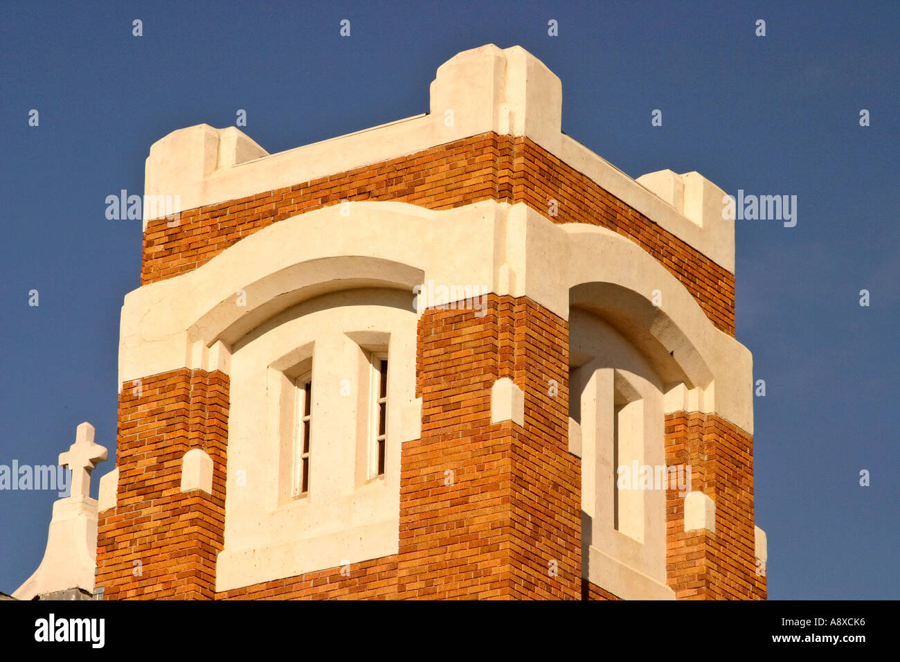 Cross and brick turret of a church in Moose Jaw in scenic Saskatchewan ...