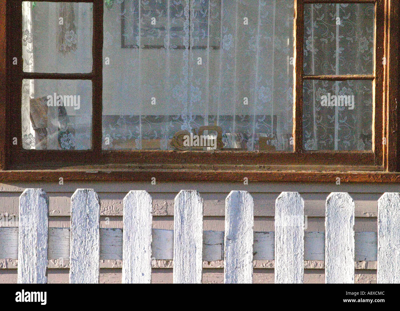 Old picket fence by window in Moose Jaw in scenic Saskatchewan Canada ...