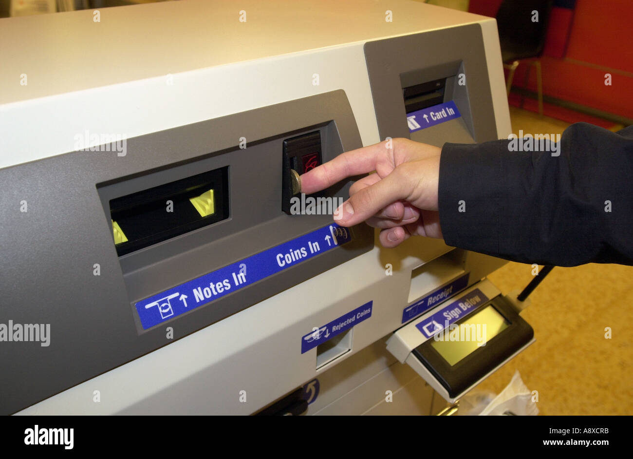 Shopper uses an automated checkout in a Sainsburys store in Bury Park ...