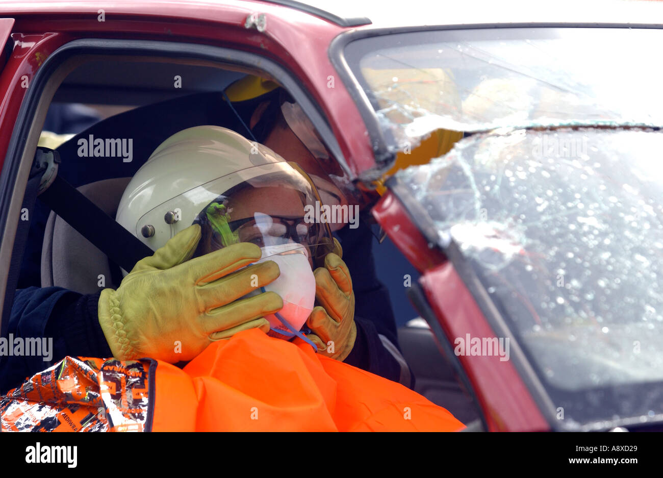 Firefighters cut open a car during a training drill Stock Photo - Alamy