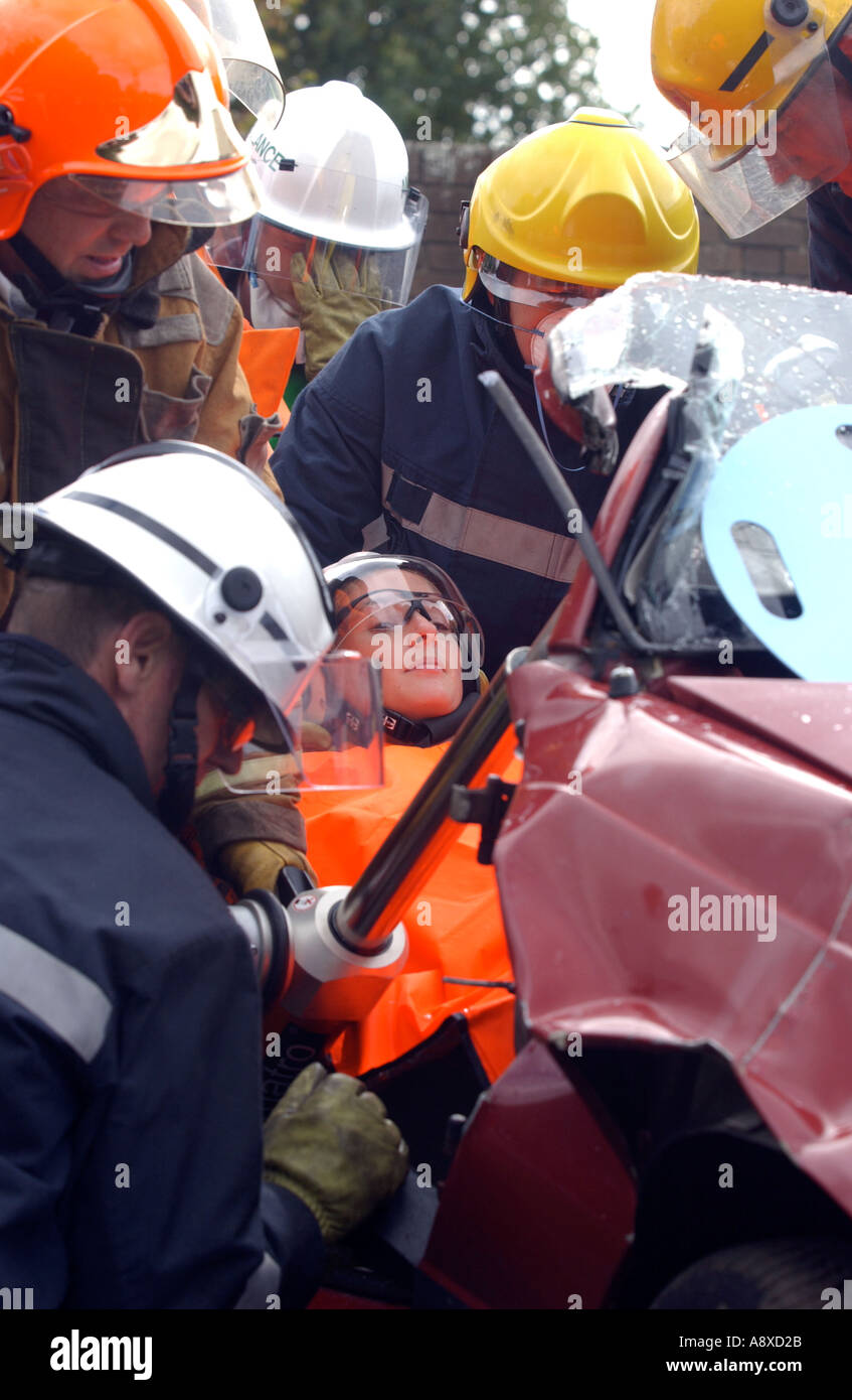 Firefighters cut open a car during a training drill Stock Photo - Alamy